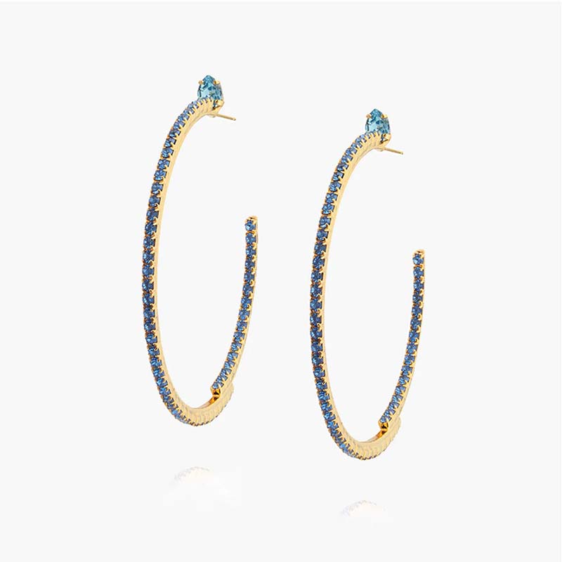 Crystal Loop Earrings Gold Sapphire - Caroline Svedbom - Smycken med ...